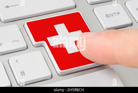 A keyboard with a labeled button - Flag of Switzerland Stock Photo - Alamy