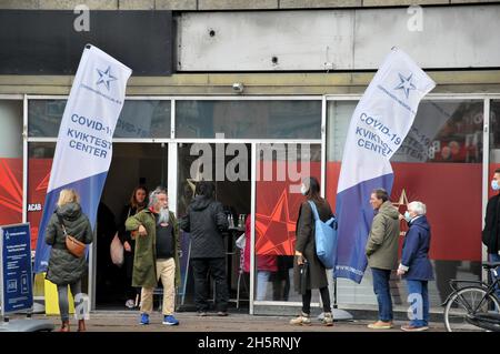 Kastrup/Copenhagen/Denmark./11 November 2021 / People standin long line ...
