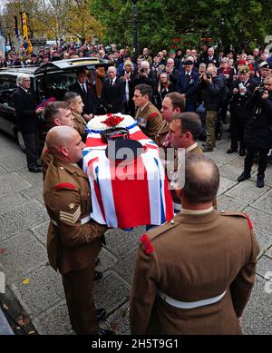 The Bearer Party carry the coffin after the funeral for Captain ...