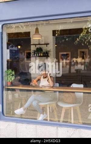 Smiling Afro Lady In Wireless Headphones Gesturing Victory Sign, Studio ...