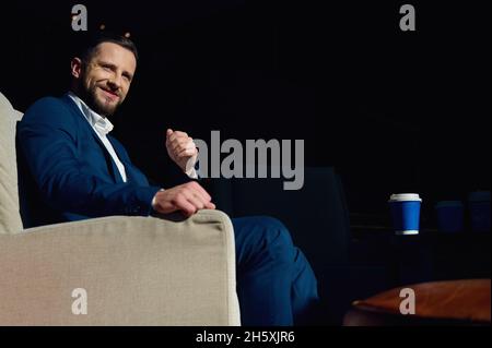 Young man sits and enjoys a coffee in the morning Stock Photo - Alamy