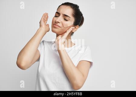 brunette patch on the face pain depression isolated background Stock ...