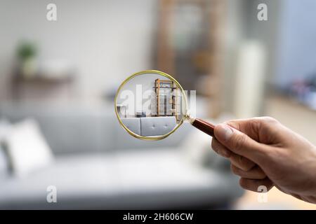 Home Property Inspection Concept With Person Holding Magnifying Glass ...