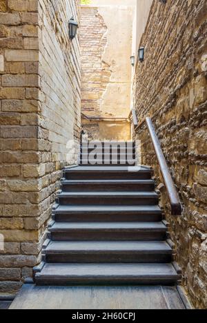 narrow staircase between two walls Stock Photo - Alamy