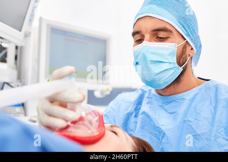 Anesthesiologist and patient during an operation with general ...