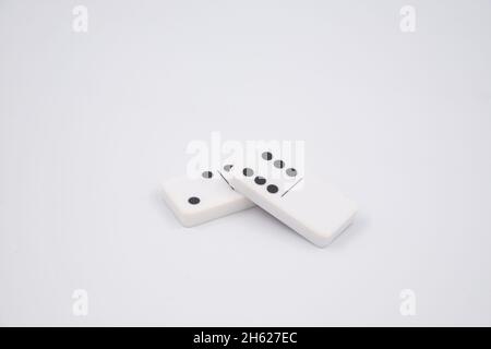 Two classic domino tiles on white background Stock Photo - Alamy