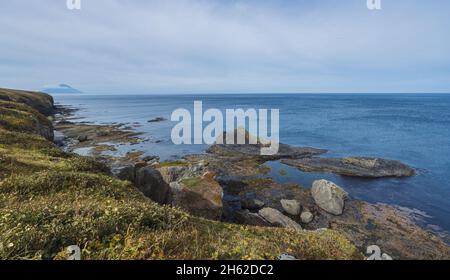 Russia, Kuril Islands, Iturup Island, White rocks on coast of the Sea ...
