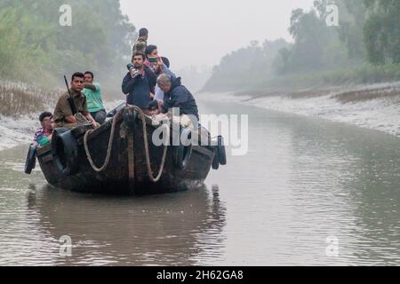 SUNDARBANS, BANGLADESH - NOVEMBER 15, 2016: Tourists cross a narrow ...