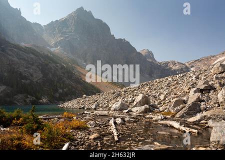Mount Wister rising high above Shoshoko Falls as forest fire smoke sets ...