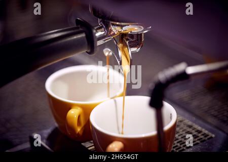 Close-up view of an espresso apparatus making a fragrant and aromatic ...