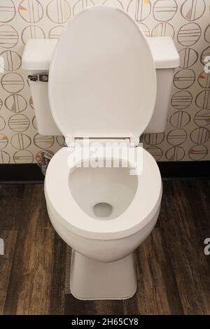 A clean white toilet bowl inside a bathroom Stock Photo Alamy