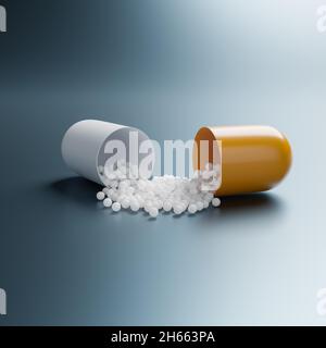 An open pill capsule spilling the active ingredient Stock Photo - Alamy