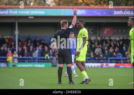 ROCHDALE, GBR. NOV 13TH Referee Anthony Backhouse shows Shadrach Ogie ...