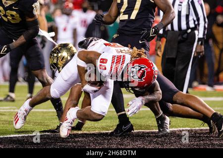 North Carolina State's Devin Carter (88) stiff arms Connecticut's Cale ...