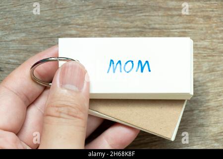 Man hold the flash card with handwriting word PDCA (Abbreviation of ...