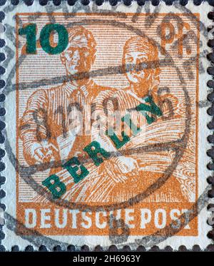 Brown vintage postage stamps from around the world on a white ...