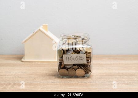 coin on wooden and brown table with copy space Stock Photo - Alamy