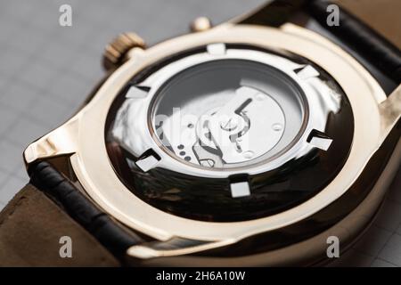 Transparent case back of self-winding kinetic wrist watch with quartz ...