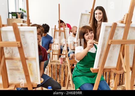 Group of young draw students smiling happy drawing at art studio Stock ...