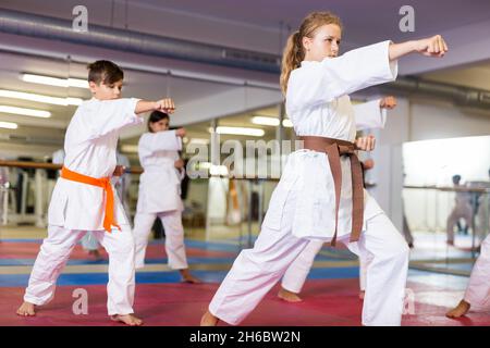 Teenager children practicing new self defense moves Stock Photo - Alamy
