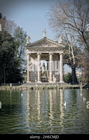 Temple of Aesculapius ancient building view at the lake of Villa Borghese in Rome Italy Stock ...