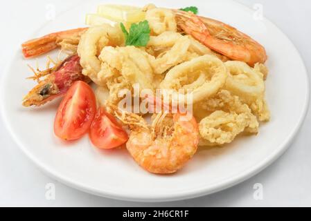Fried calamari and shrimps on white plate Stock Photo - Alamy