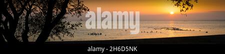 Sunset on Lough Neagh on a warm Autumn evening Stock Photo - Alamy