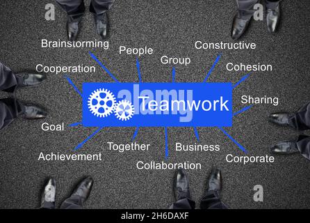 Feet around teamwork concept drawn on a road Stock Photo - Alamy