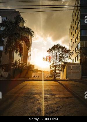 Sunset behind buildings with beautiful cloudy sky. Beautiful red ...