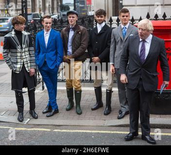Boris Johnson attending a photocall on Savile Row, alongside nine male ...