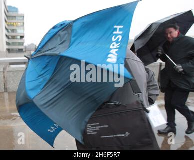 As severe storms move across the UK, wind and rain batter commuters on ...