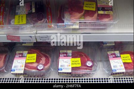 Security tags on meat at tesco, ashford, uk Stock Photo - Alamy