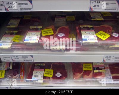Security tags on meat at tesco, ashford, uk Stock Photo - Alamy