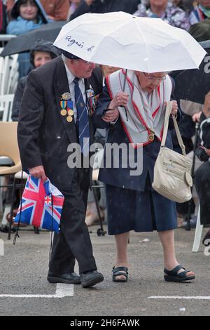 Normandy war veterans finished their march past Arromanche in France ...