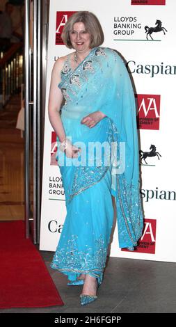 The new Home Secretary Theresa May wore a sari showing her midriff for ...