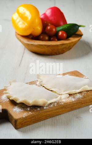 Unleavened dough pie stuffed with fresh herbs. Qutabs or kutab ...