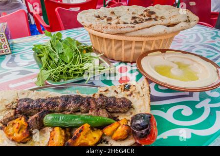Local food kabab, bread and hummus at the central Souq in Kuwait City ...