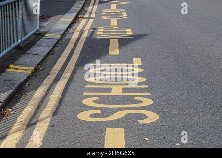 school keep clear road markings outside the entrance to a school ...