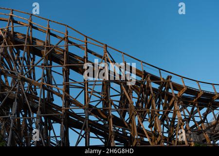 Curve of a large wooden roller coaster Stock Photo - Alamy
