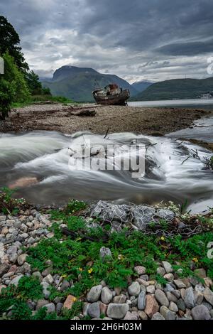 Shipwreck with Ben Nevis and Fort William in background at Loch Linnhe ...