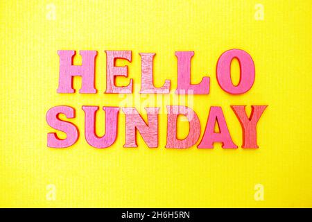 Hello Sunday alphabet letters on yellow background Stock Photo - Alamy