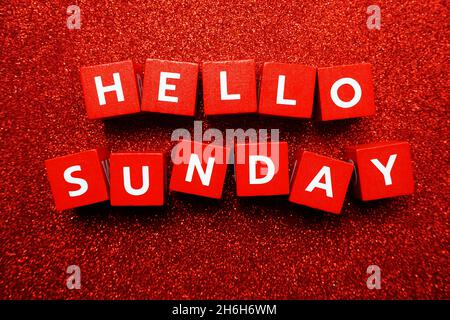 Hello Sunday alphabet letter on blue glitter background Stock Photo - Alamy