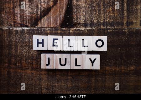 Hello July alphabet letters on pink glitter background Stock Photo - Alamy
