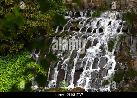 landscape of beautiful Artificial waterfall in garden at the public ...