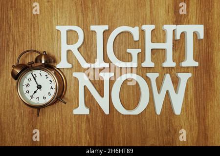 Right Now Word alphabet letters on wooden background Stock Photo - Alamy