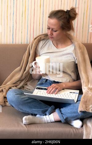 Yound woman remote working from home during quarantine covid-19. Freelance job selfisolated ...