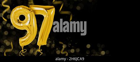 Gold foil balloon number number 97 on a background of black tinsel ...