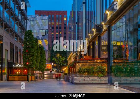 View of restaurants and buildings in Springfields at dusk, Manchester ...