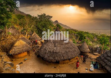 Sunset over traditional huts of the Otuho or Lutoko tribe in the ...