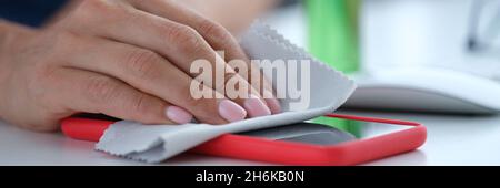 Woman wiping cell phone screen with antiseptic napkin closeup Stock ...